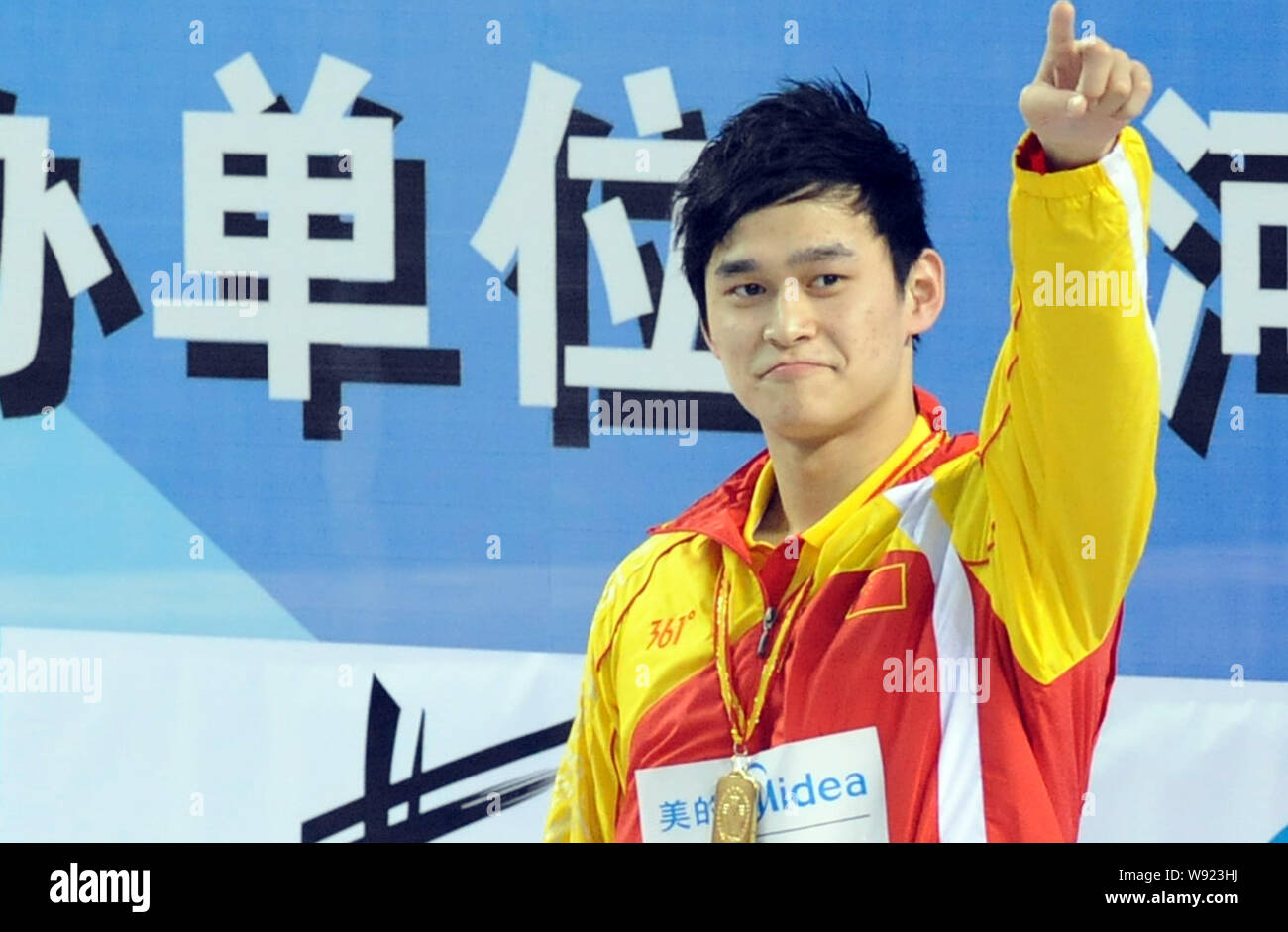Chinese Olympic swimming champion Sun Yang waves after winning the pre ...