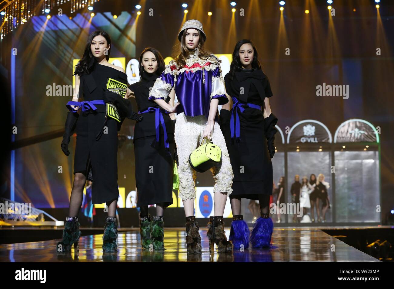 Models display new creations by fashion designer Mark Cheung in the G ...