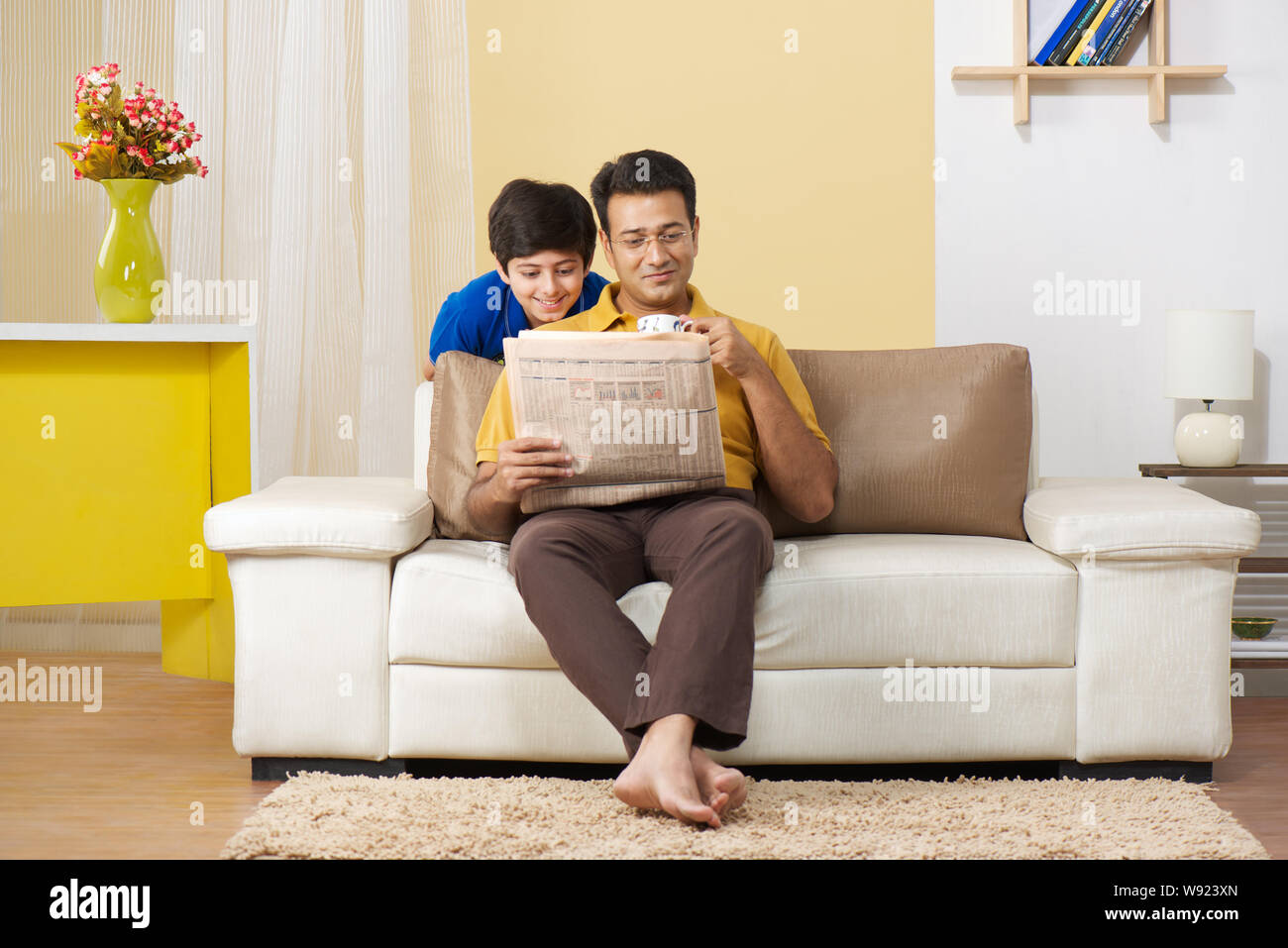 Boy reading newspaper hi-res stock photography and images - Alamy