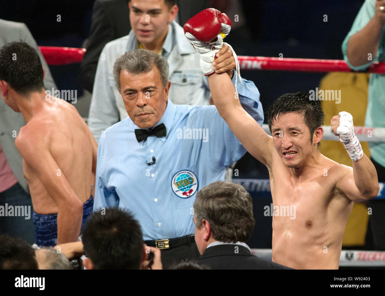Chinese Olympic boxing champion Zou Shiming (1st right) waves after his ...