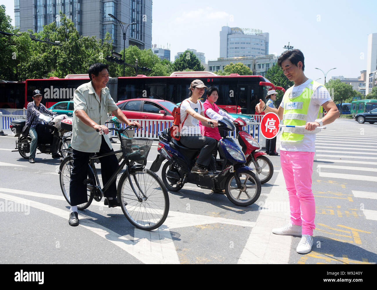 Taiwanese singer and actor Richie Jen, right, stands in front of ...
