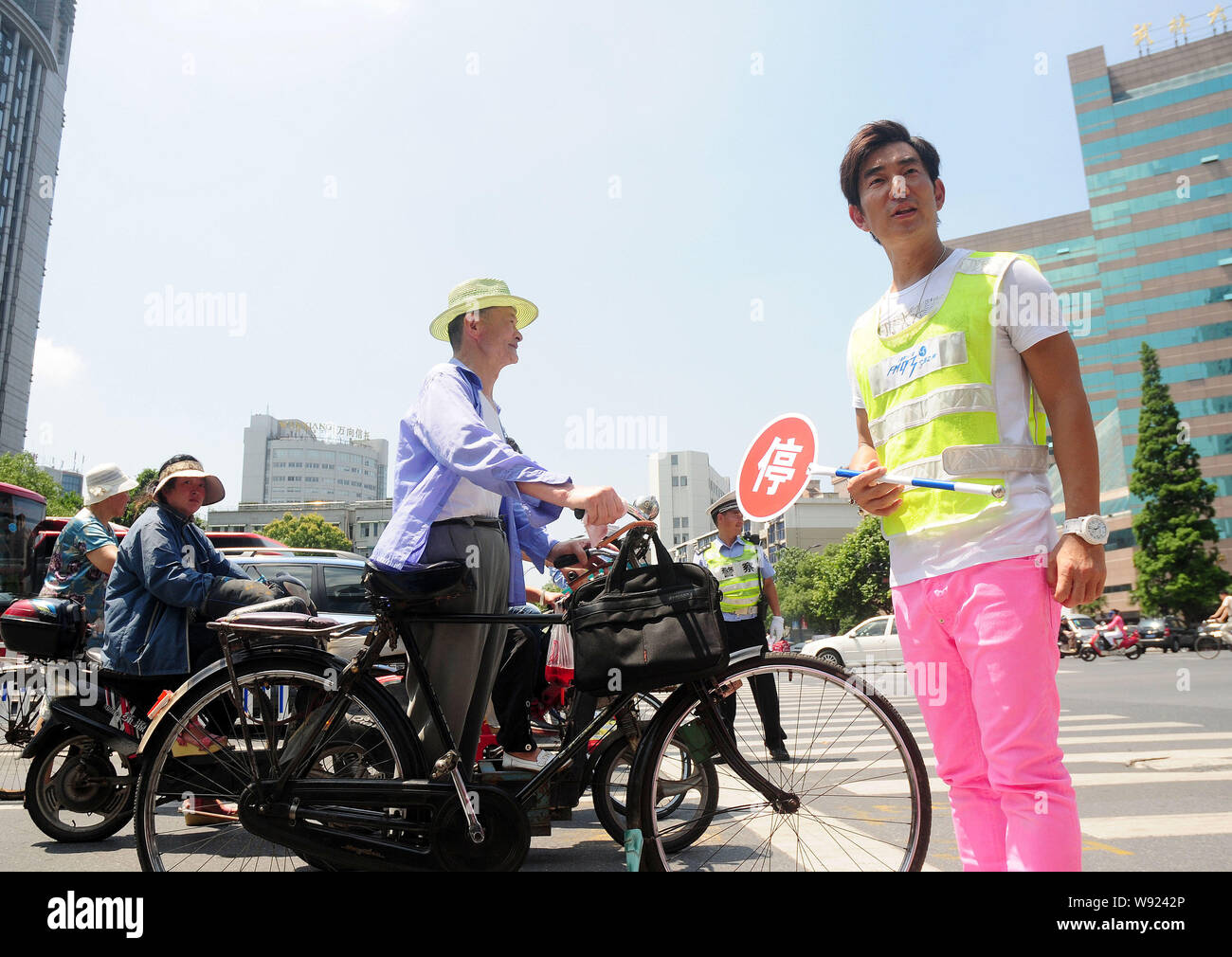 Taiwanese singer and actor Richie Jen, right, stands in front of ...