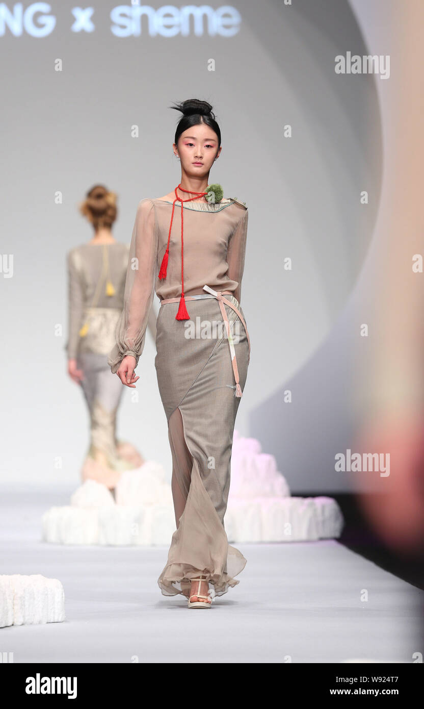 A model displays a new creation by female Chinese designer Ji Cheng at ...