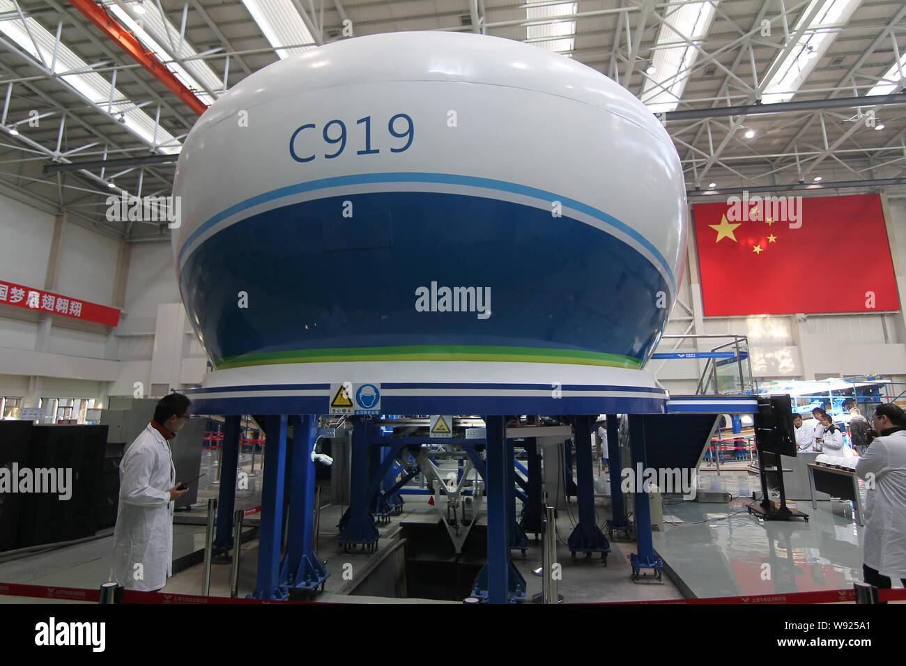 Chinese engineers examine the testing platform for Chinas C919 jumbo ...