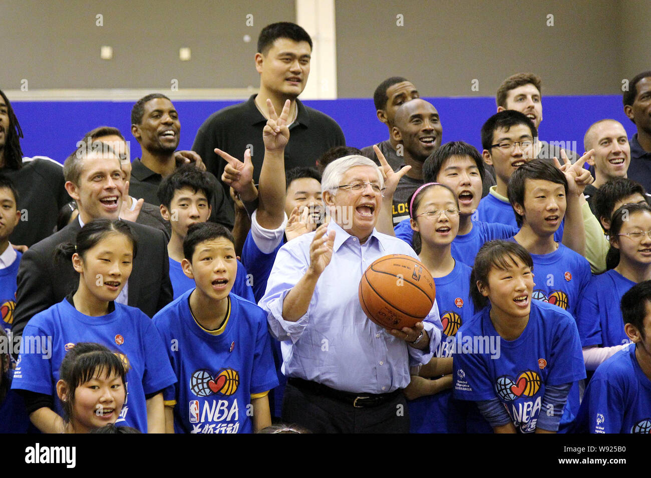 Retired Chinese basketball superstar Yao Ming, top center left, NBA ...