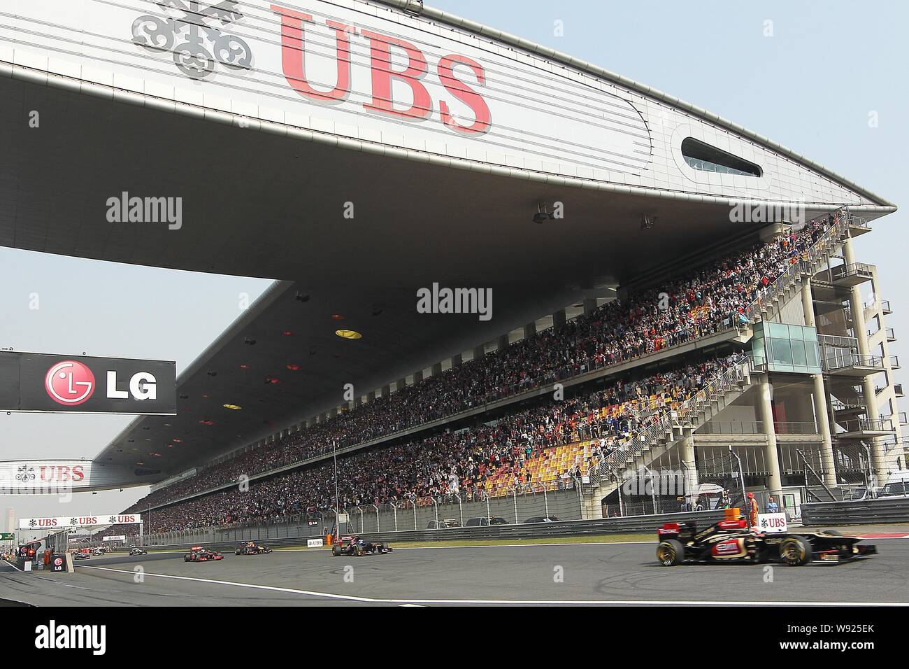 F1 drivers compete during the 2013 Formula One Chinese Grand Prix at ...