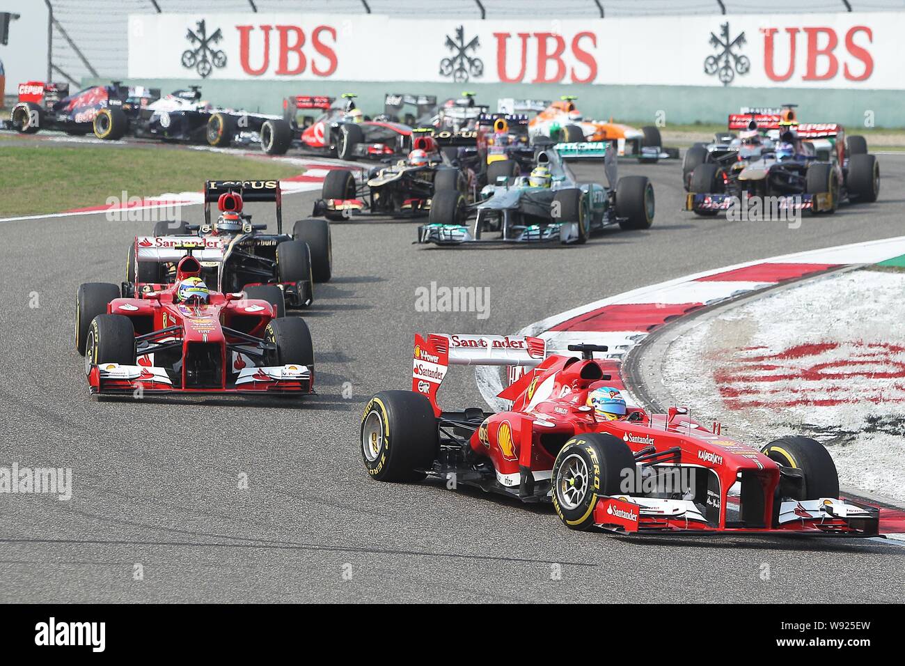 Spanish F1 driver Fernando Alonso of Ferrari, front, and other drivers ...
