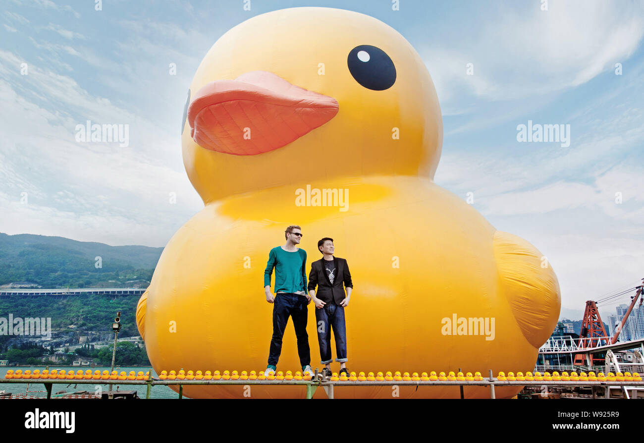 Hong Kong singer and actor Andy Lau (right) poses in front of the giant ...
