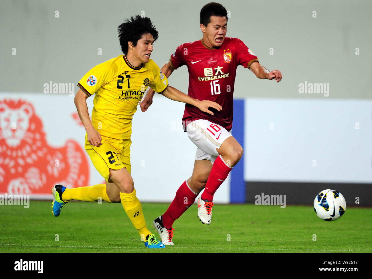 Huang Bowen of Chinas Guangzhou Evergrande FC, right, challenges Kim ...