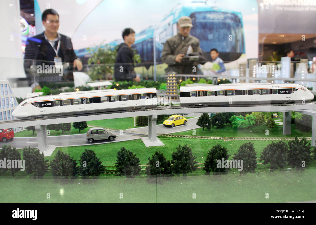--FILE--Chinese visitors look at models of CRH (China Railway High ...