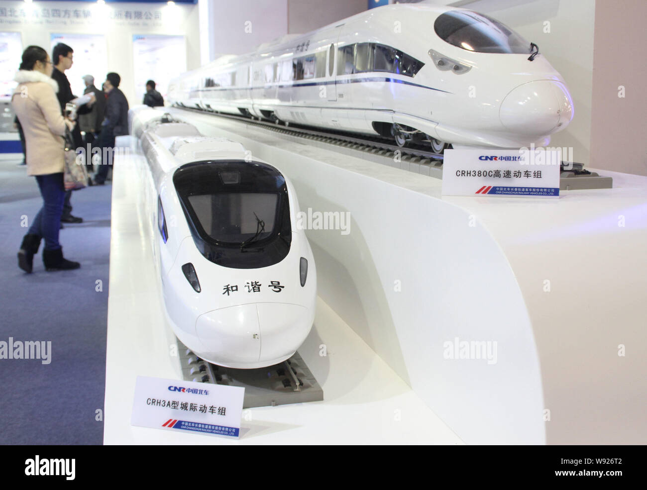 --FILE--Visitors look at models of CRH trains at the stand of CNR ...