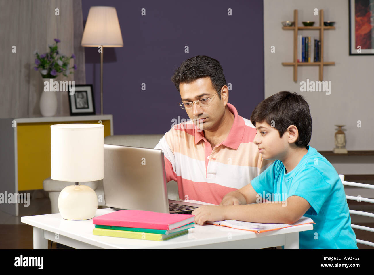 Father teaching son using laptop hi-res stock photography and images ...