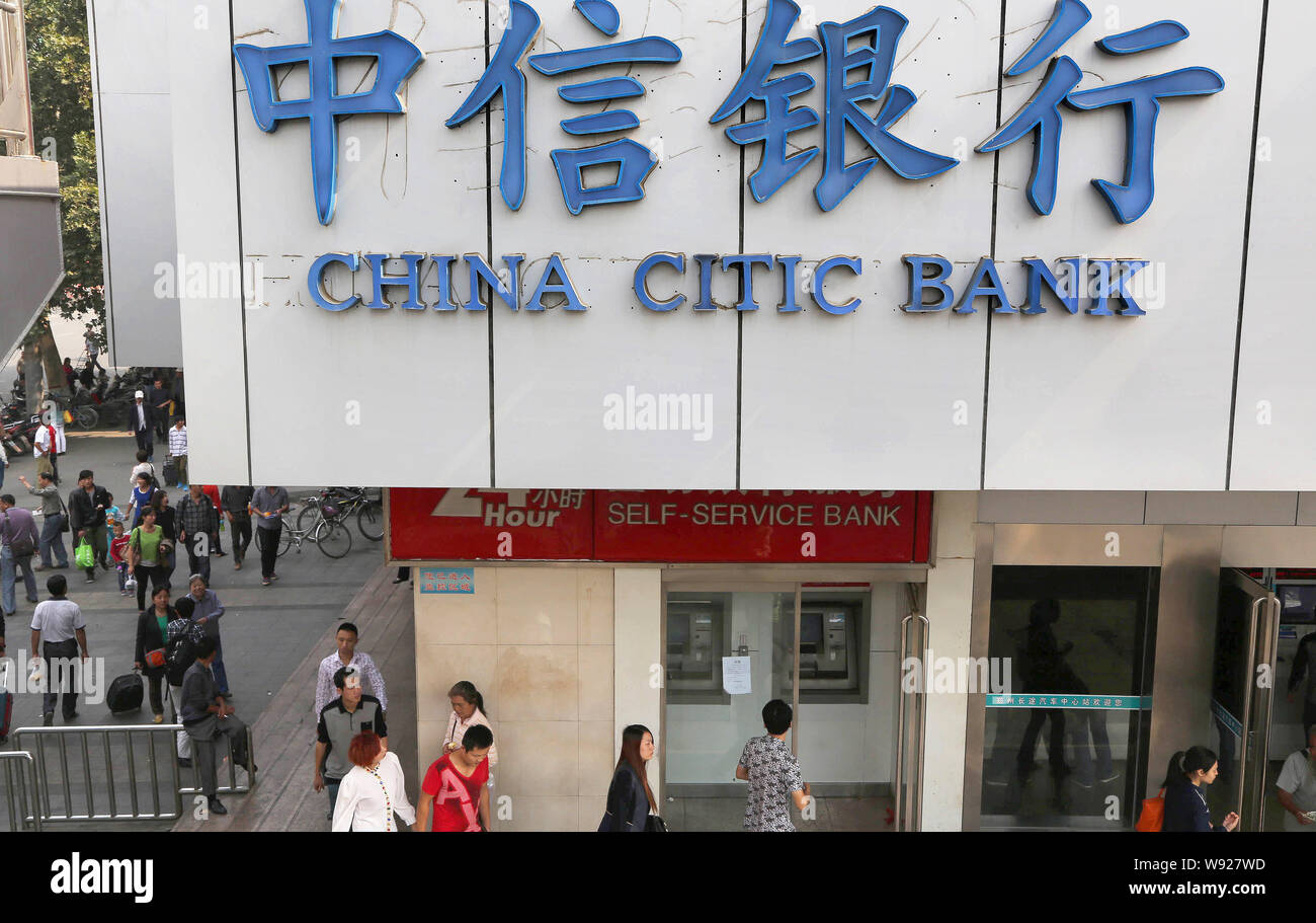 --FILE--Pedestrians walk past a branch of China Citic Bank in Zhengzhou ...