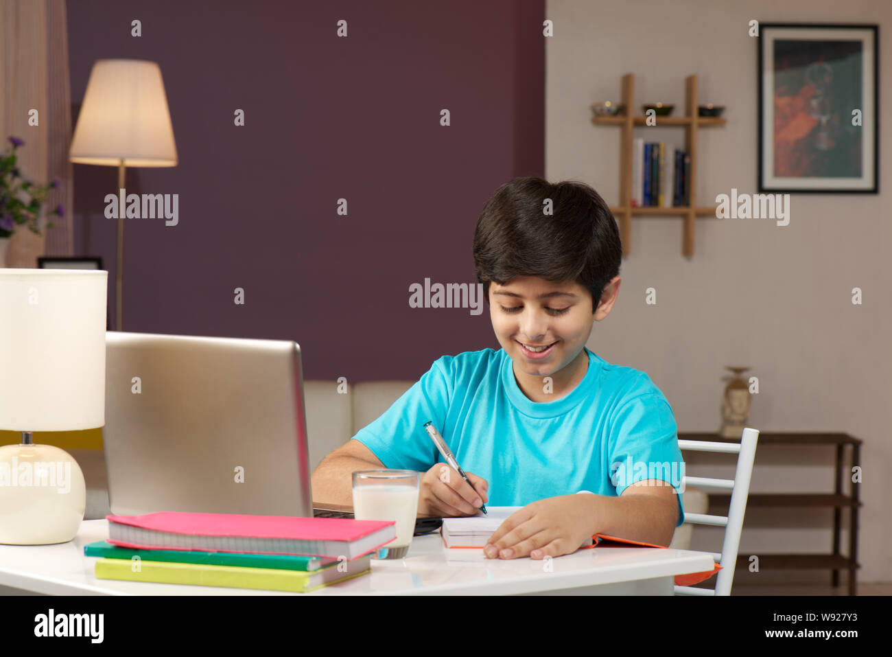 Boy studying at home Stock Photo - Alamy