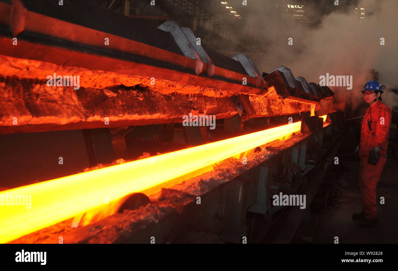 --FILE--A Chinese worker is seen at a steel plant in Dalian, northeast ...