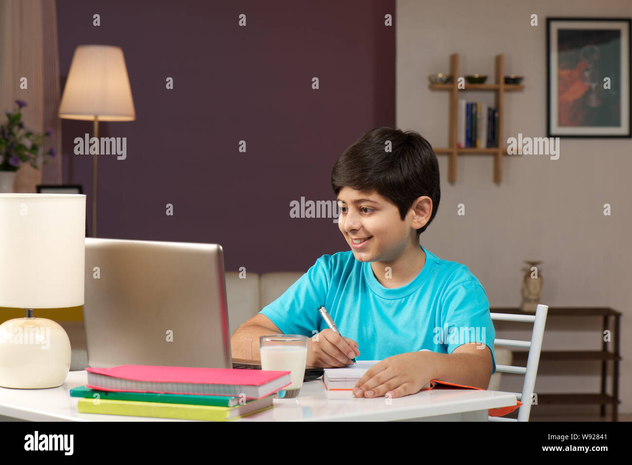 Boy studying at home Stock Photo - Alamy