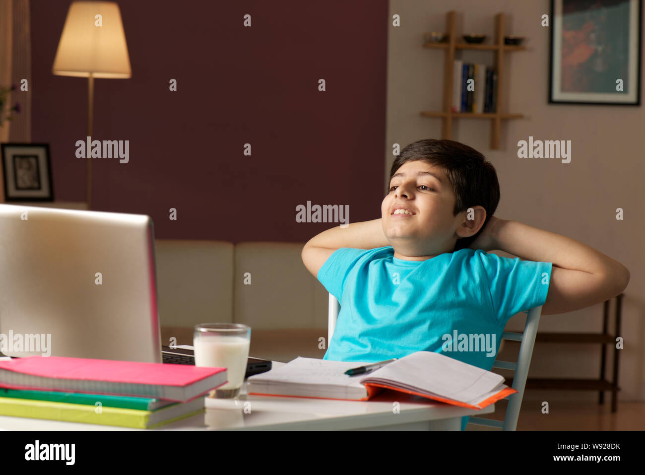 Boy studying at home Stock Photo - Alamy