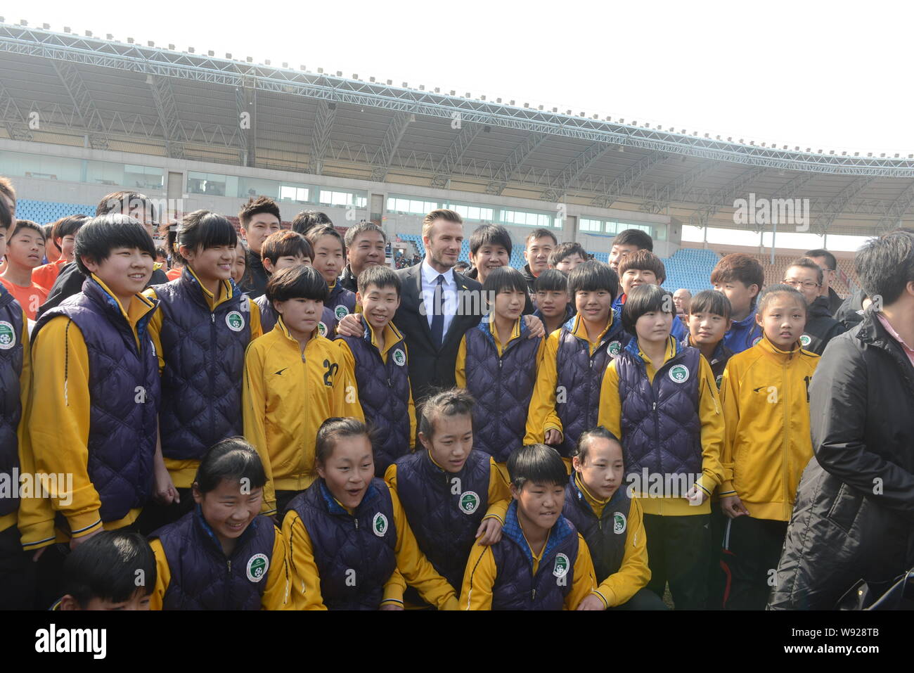 English soccer superstar David Beckham, center, poses with young ...