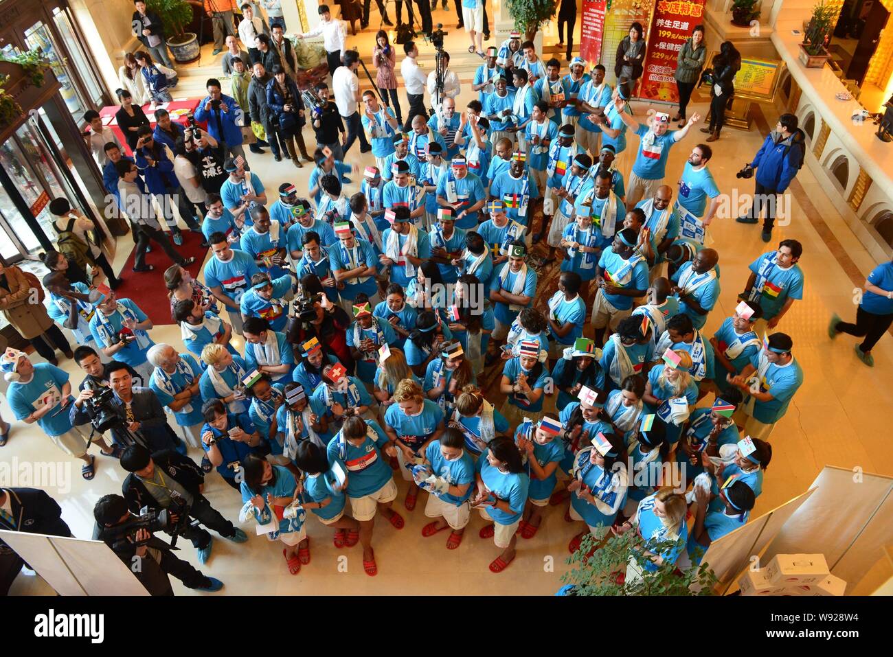 Participants get ready for being in a sauna room during a challenge to ...