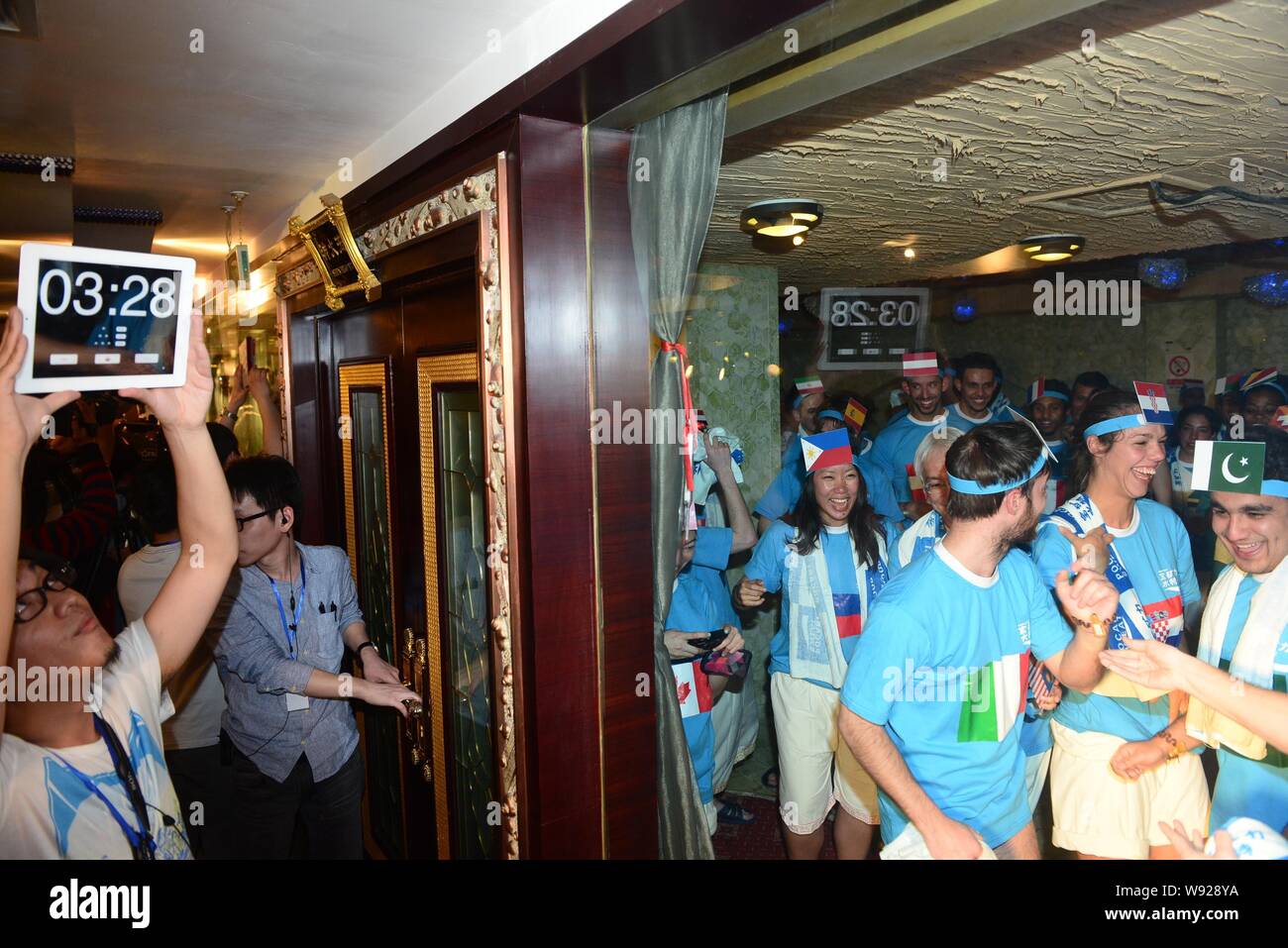 A member of Guinness staff shows the remaining time to participants ...