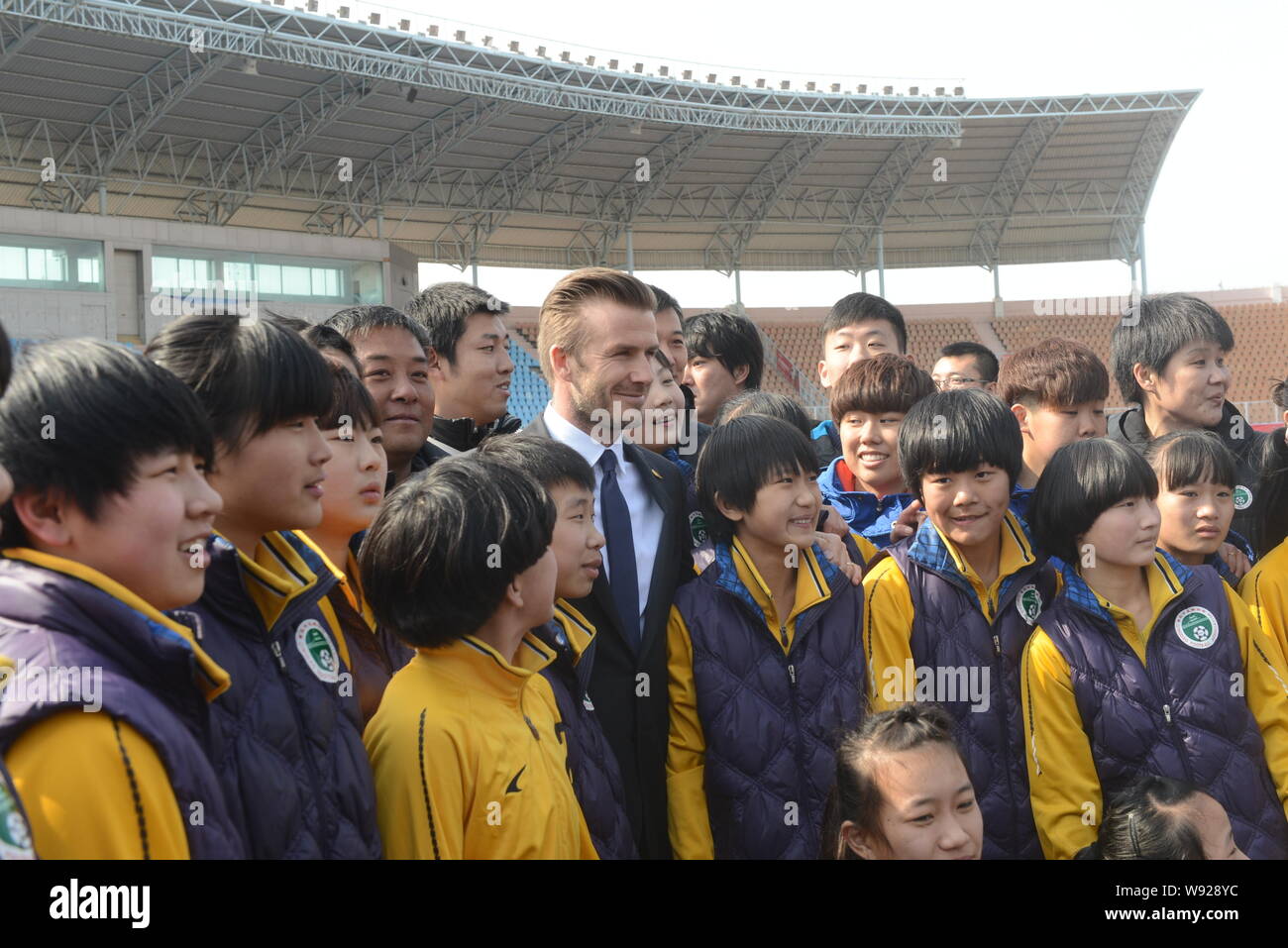 English soccer superstar David Beckham, center, poses with young ...