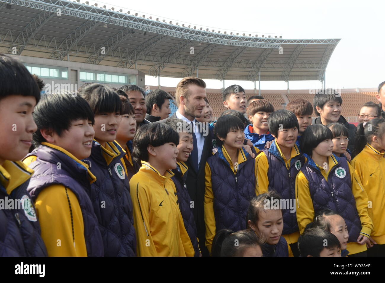 English soccer superstar David Beckham, center, poses with young ...
