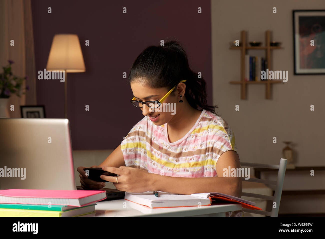 Indian girl studying on laptop desk hi-res stock photography and images ...