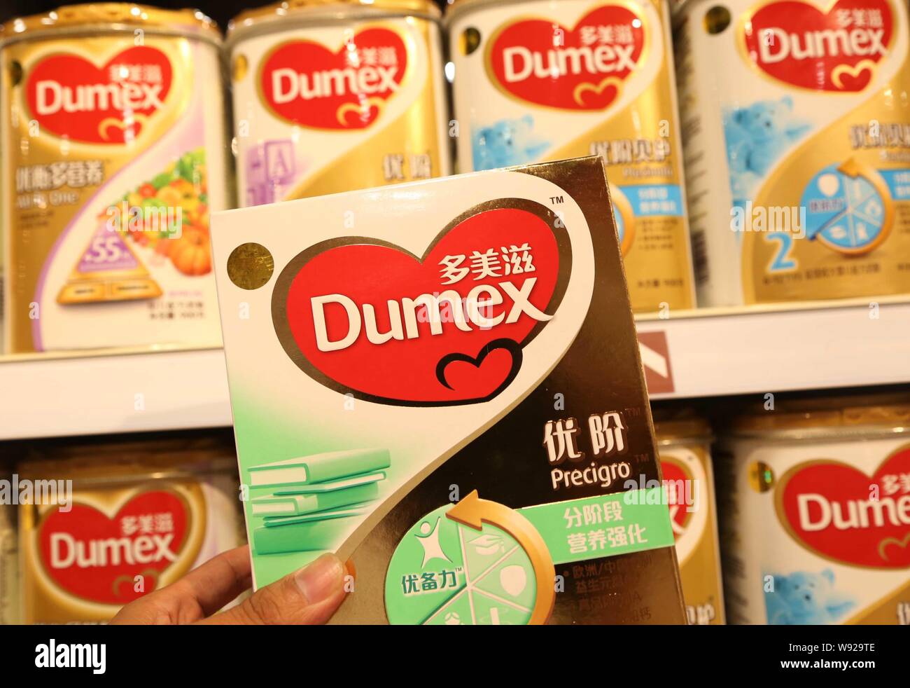 --FILE--A customer shops for a box of Dumex baby formula of Danone at a ...