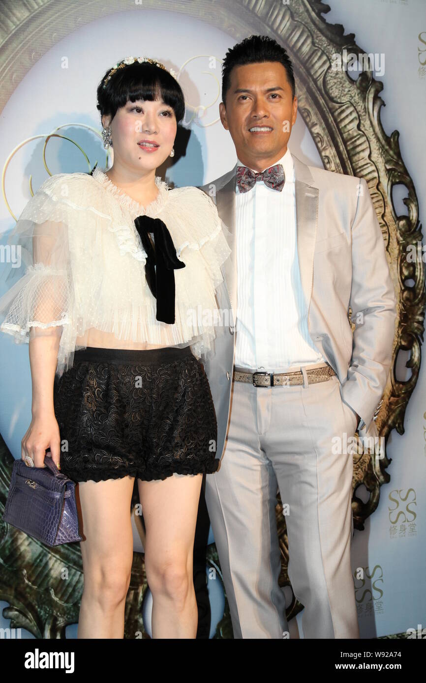 Hong Kong actor Ray Lui, right, poses with his wife Yang Xiaojuan ...