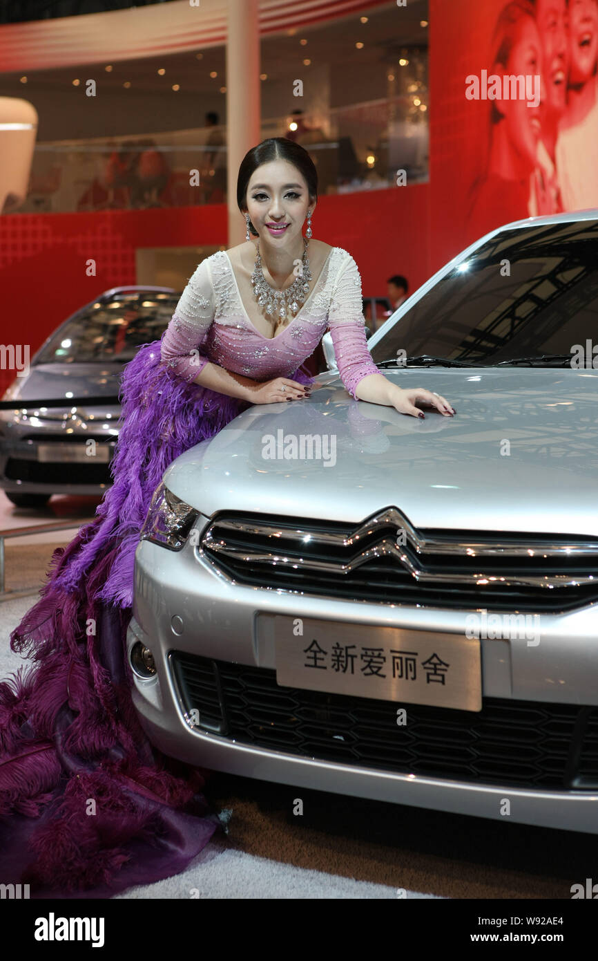 Chinese model Cao Yang poses with a Citroen Elysee during the 15th ...