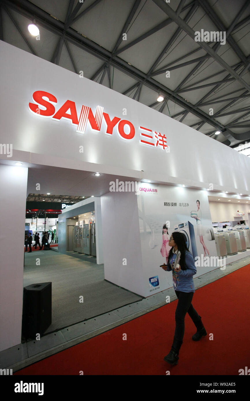 --FILE--A visitor walks past Diqua washing machines of Hefei Rongshida ...