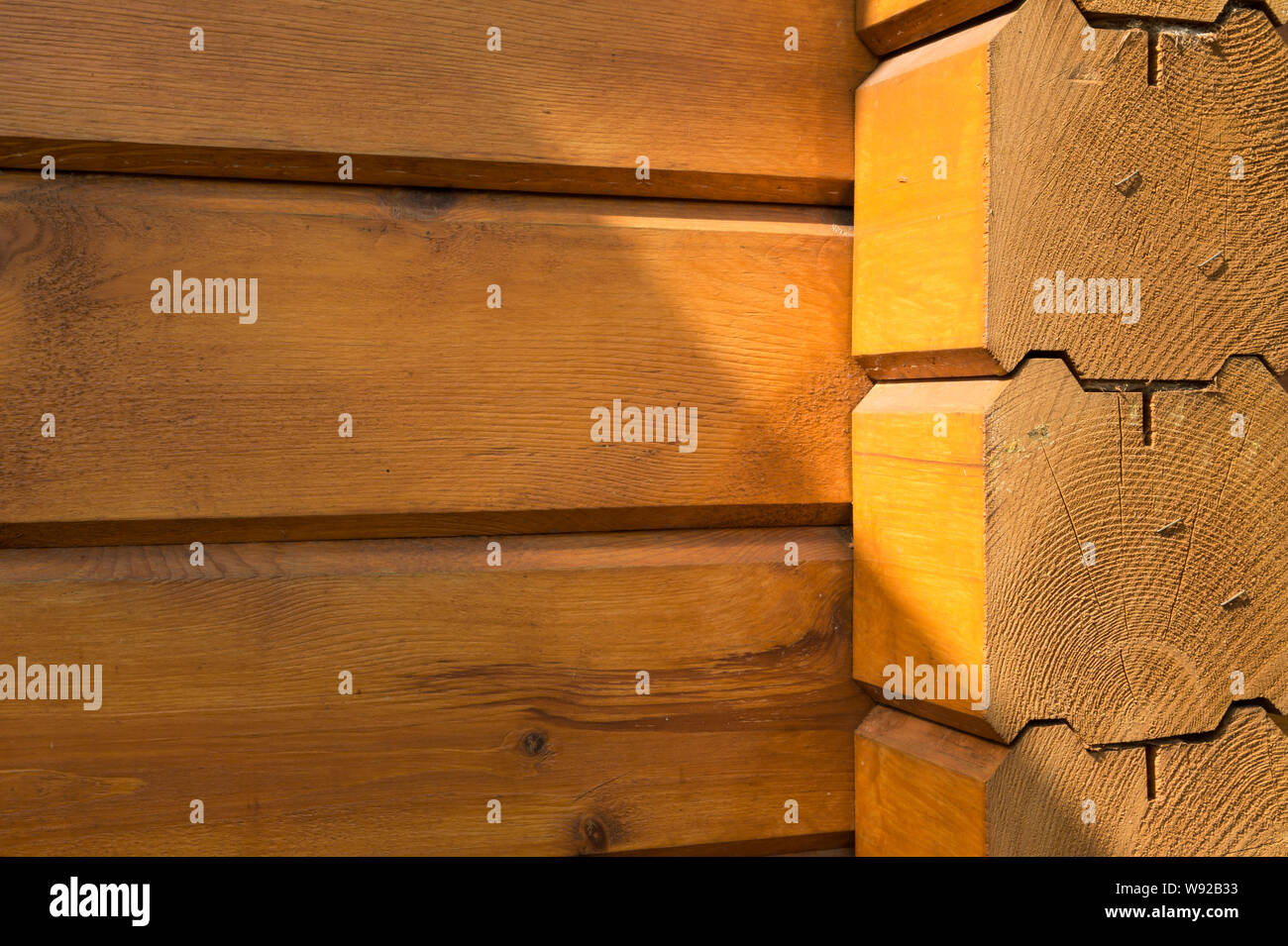 The building is made of square wooden beams. The outer wall, joint ...