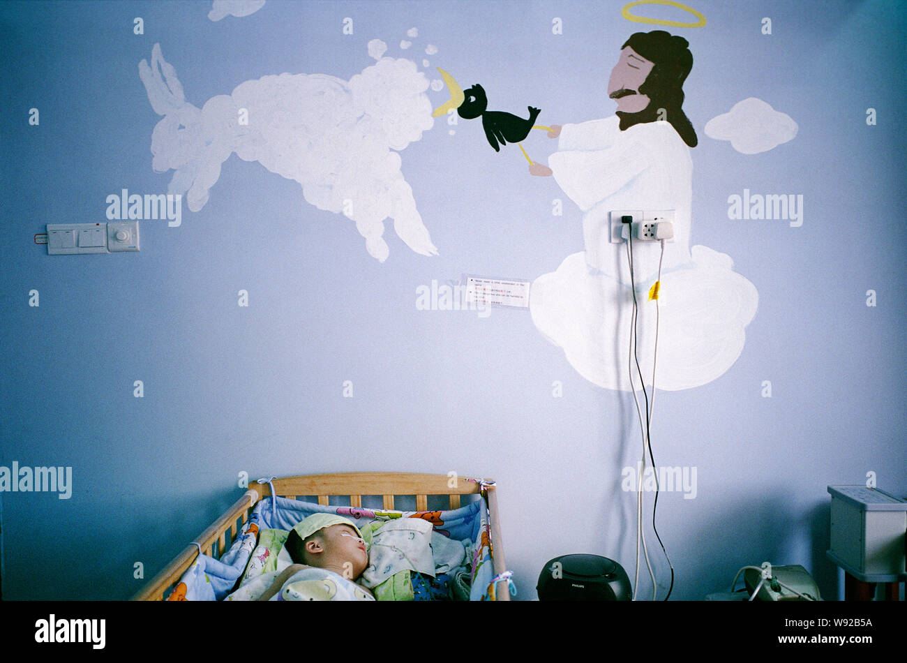 A boy sleeps at the Butterfly Home in Changsha, capital of Central ...