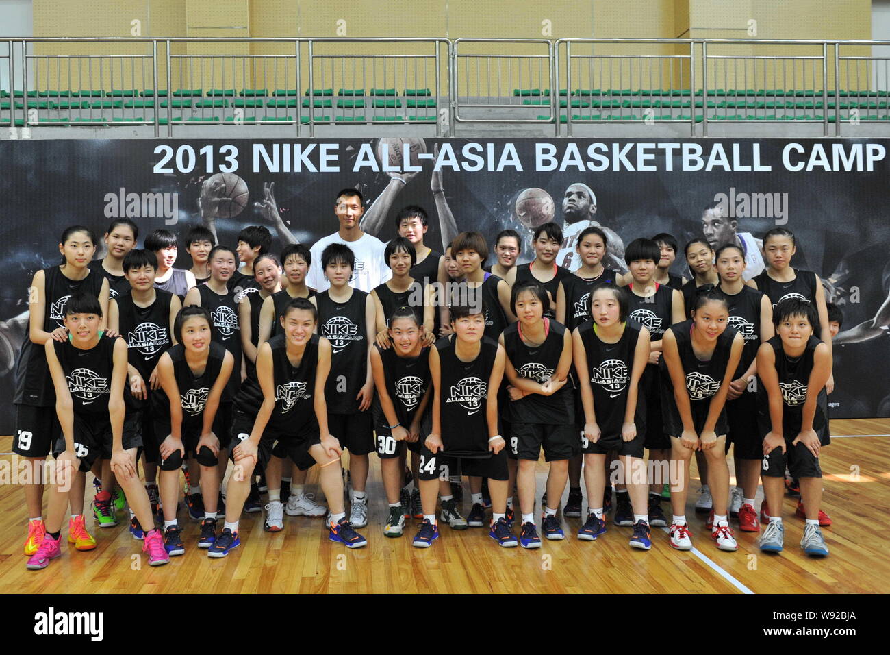 Chinese basketball player Yi Jianlian, tallest, poses with fans during ...