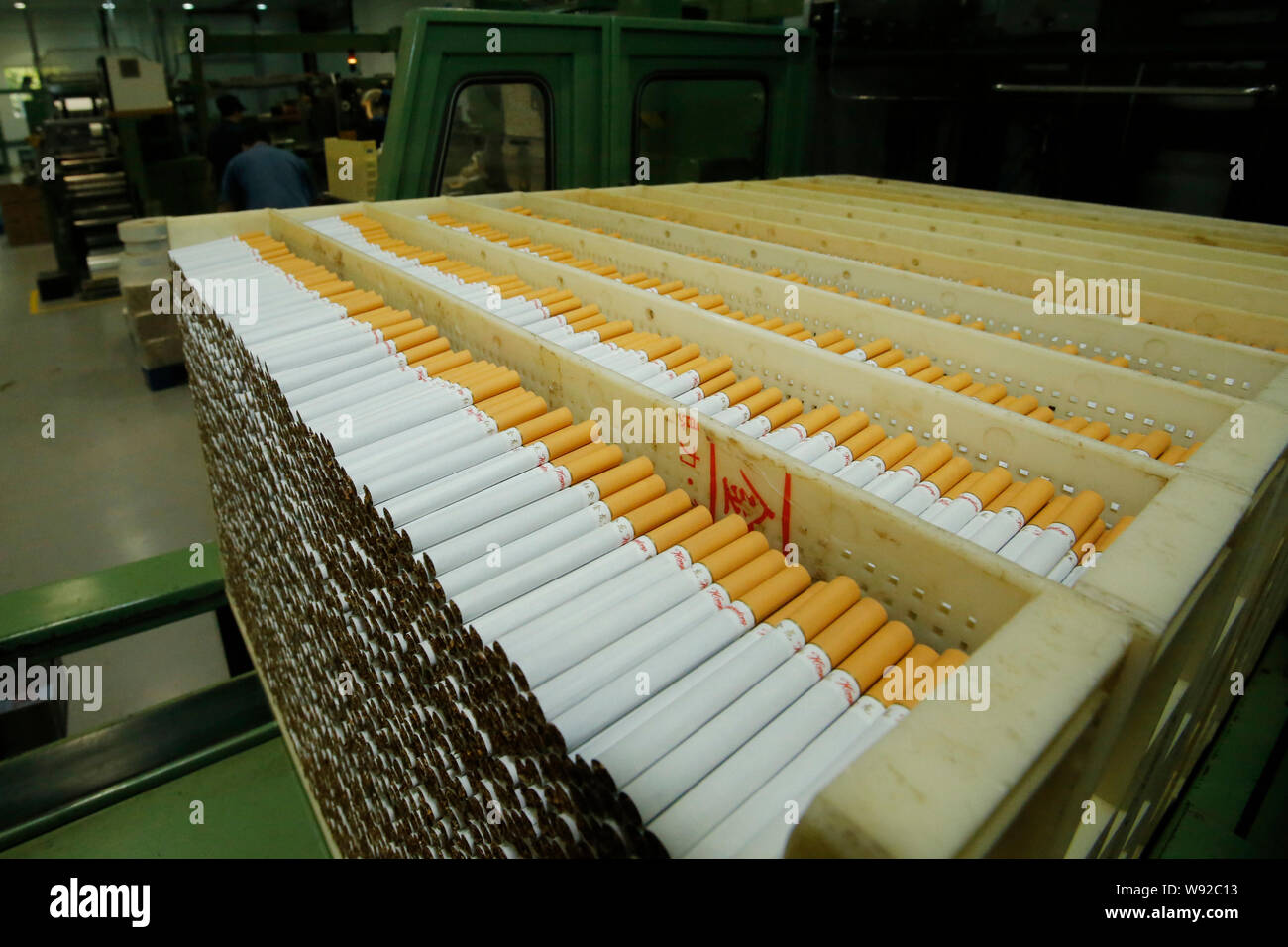--FILE--Cigarettes produced are pictured at an assembly line at a ...