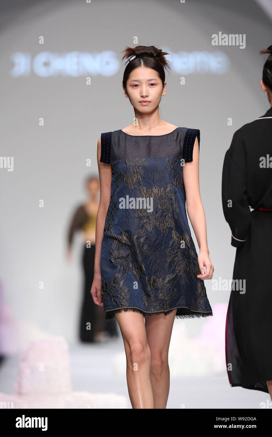 A model displays a new creation by female Chinese designer Ji Cheng at ...