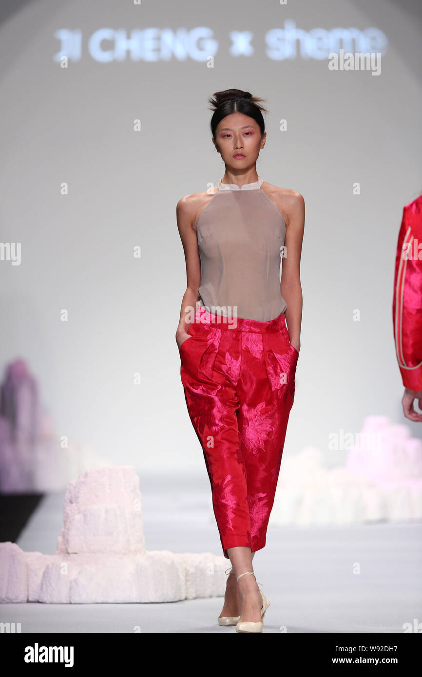 A model displays a new creation by female Chinese designer Ji Cheng at ...
