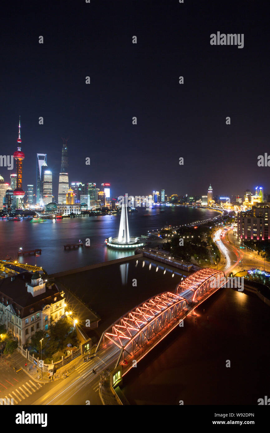 --FILE--Night view of the Waibaidu Bridge, front, over the Suzhou Creek ...