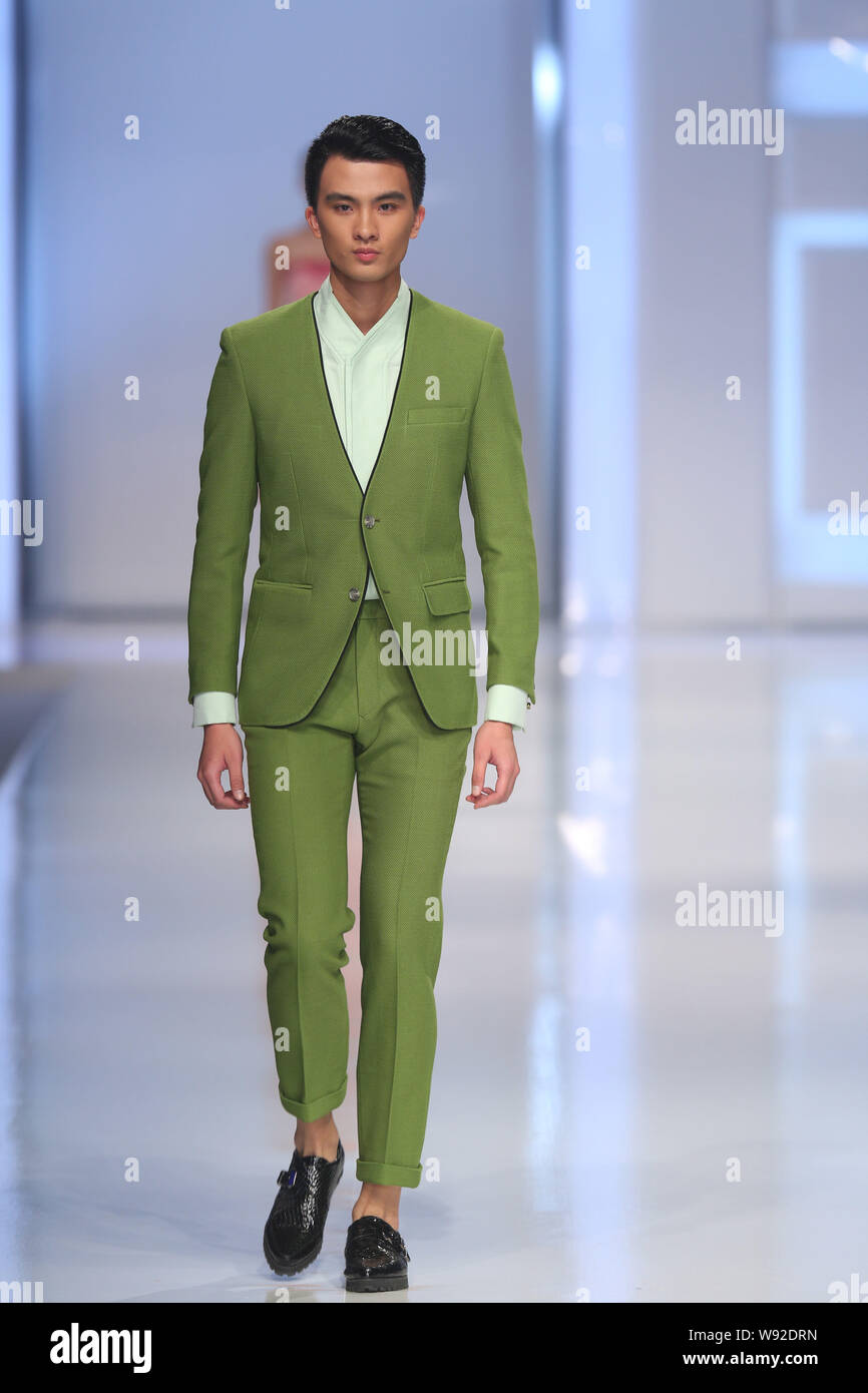 A model displays a new creation by Chinese brother designers Wu Xuewei ...