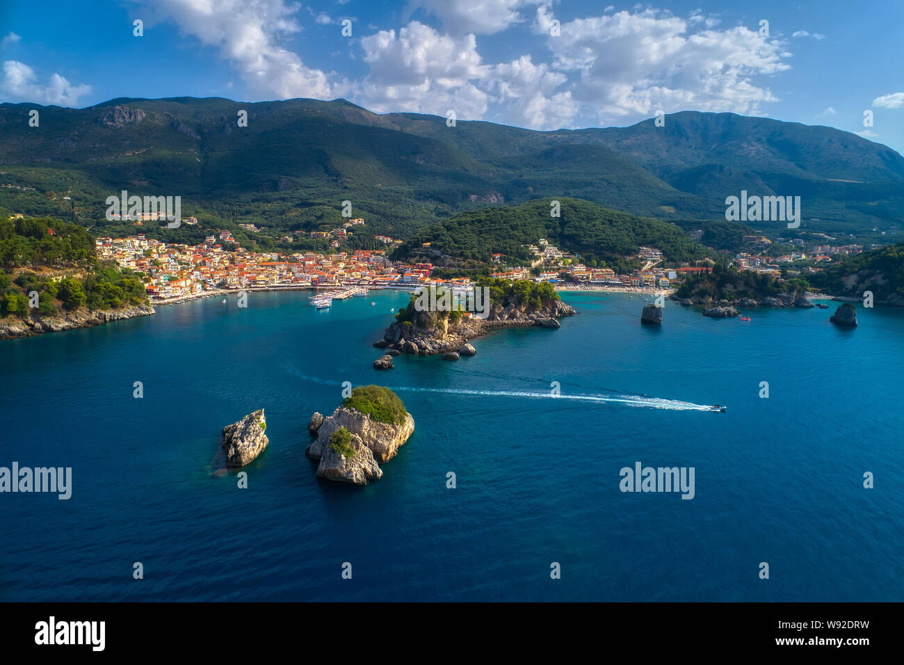 Aerial cityscape view of the coastal city of Parga, Greece during the ...