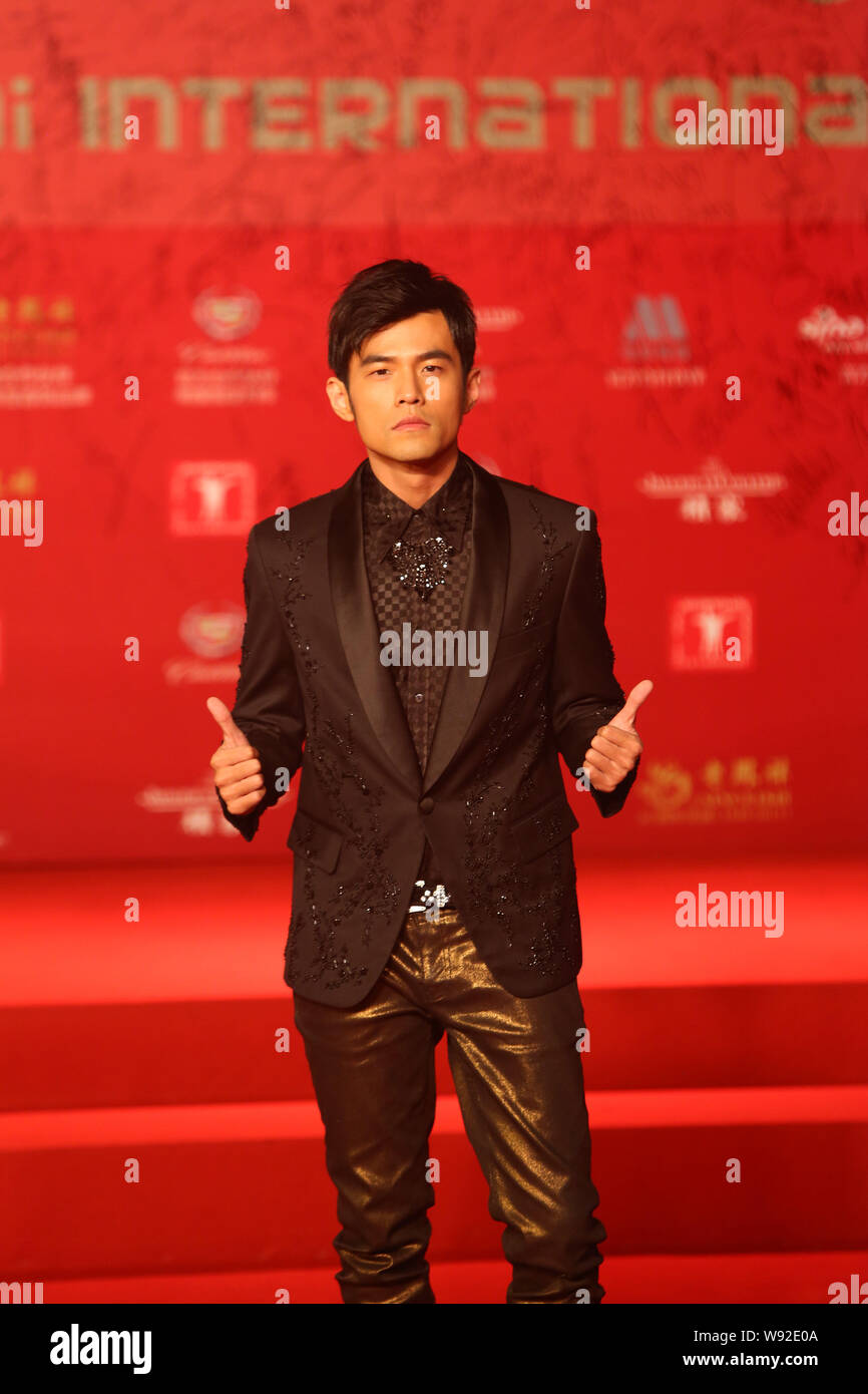 Taiwanese singer and actor Jay Chou poses on the red carpet as he ...