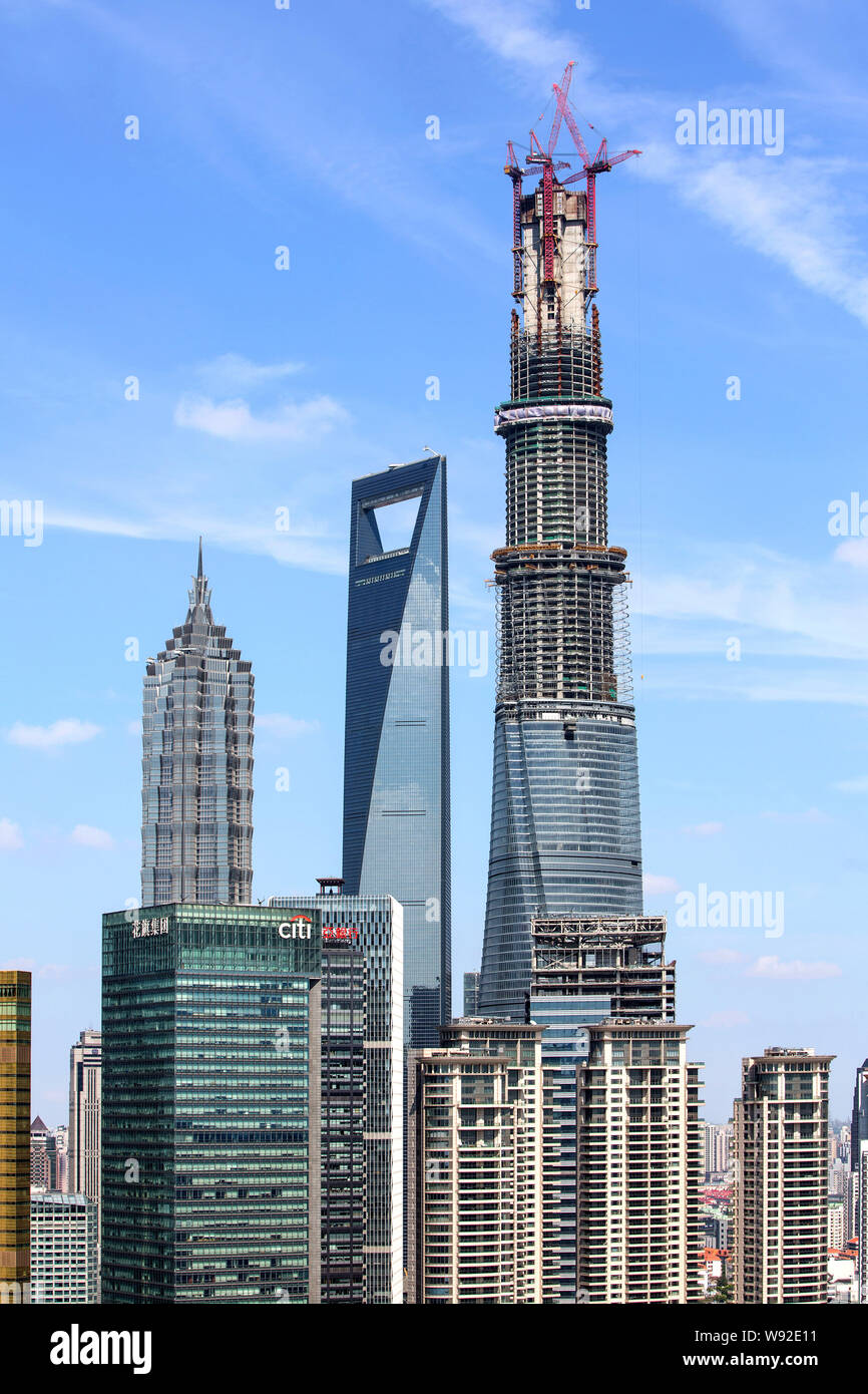 --FILE--The Shanghai Tower, tallest, is under construction next to ...