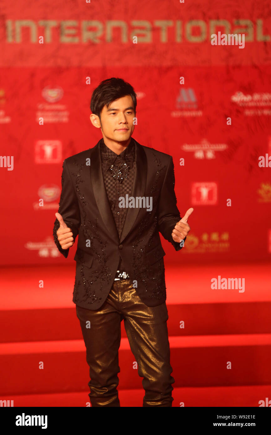 Taiwanese singer and actor Jay Chou poses on the red carpet as he ...