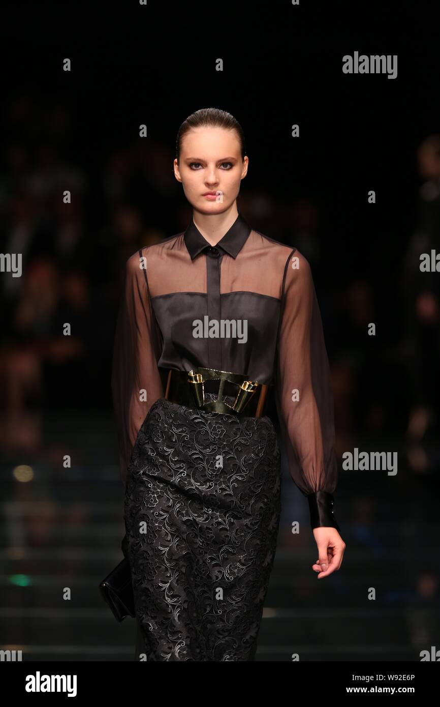 A model displays a new creation at a fashion show of Hugo Boss in ...