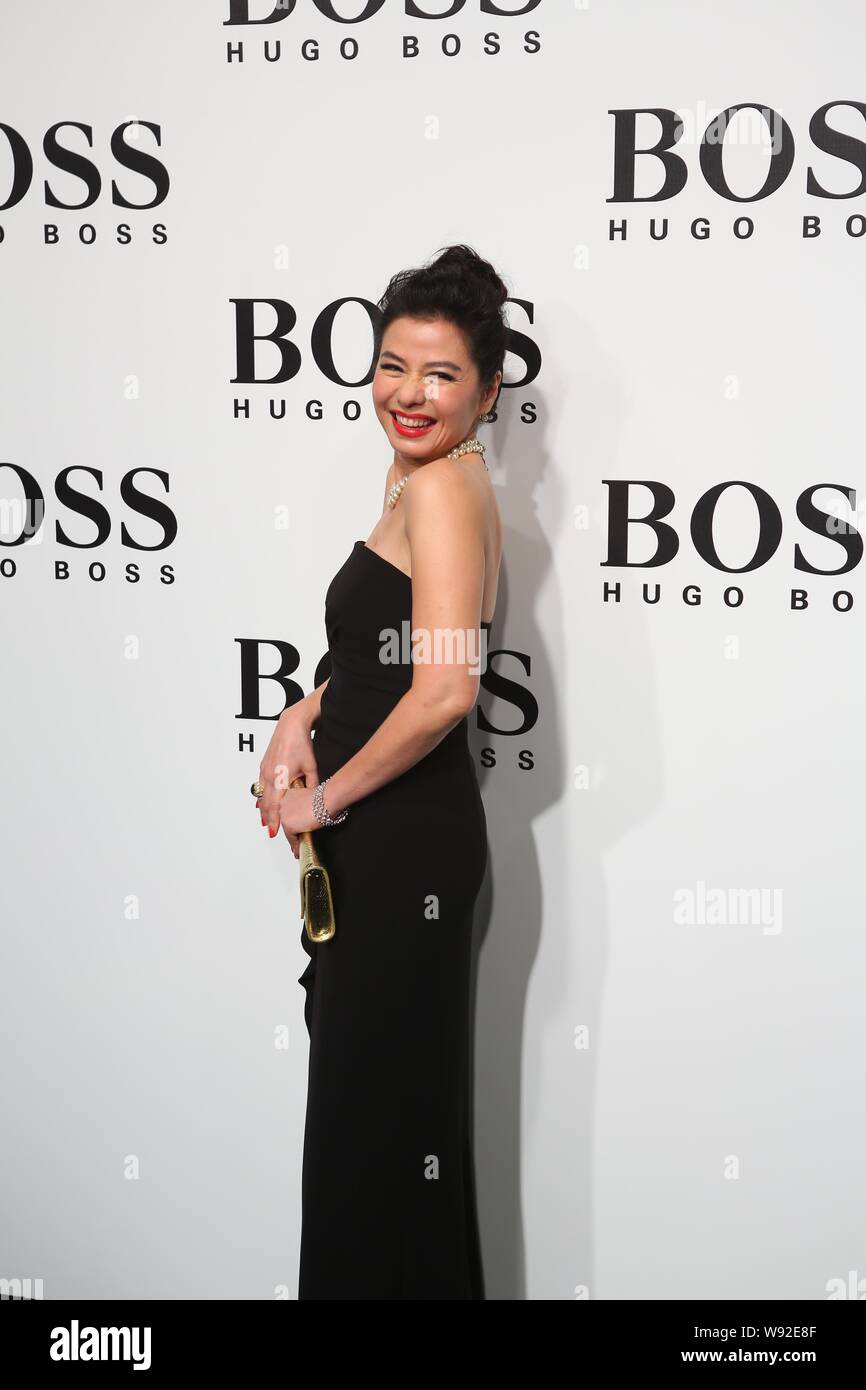 Hong Kong actress Cherie Chung poses as she arrives for a fashion show ...
