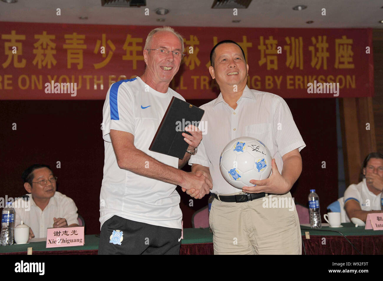 Swedish soccer coach Sven-Goran Eriksson, left, shakes hands with a ...
