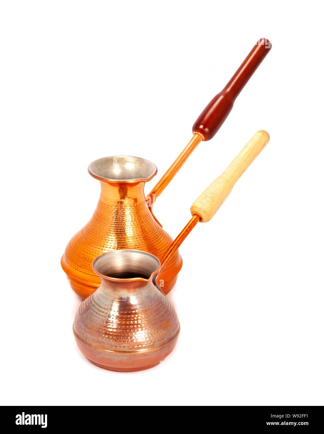 Two cezves of different sizes on a white background side view. Turkish ...