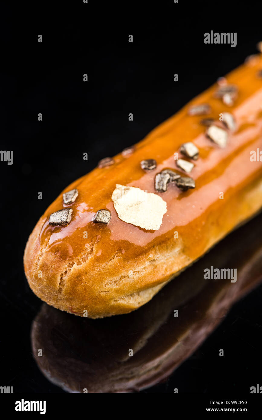 French Artisan Eclair on Black Reflective Background,Copy Space ...
