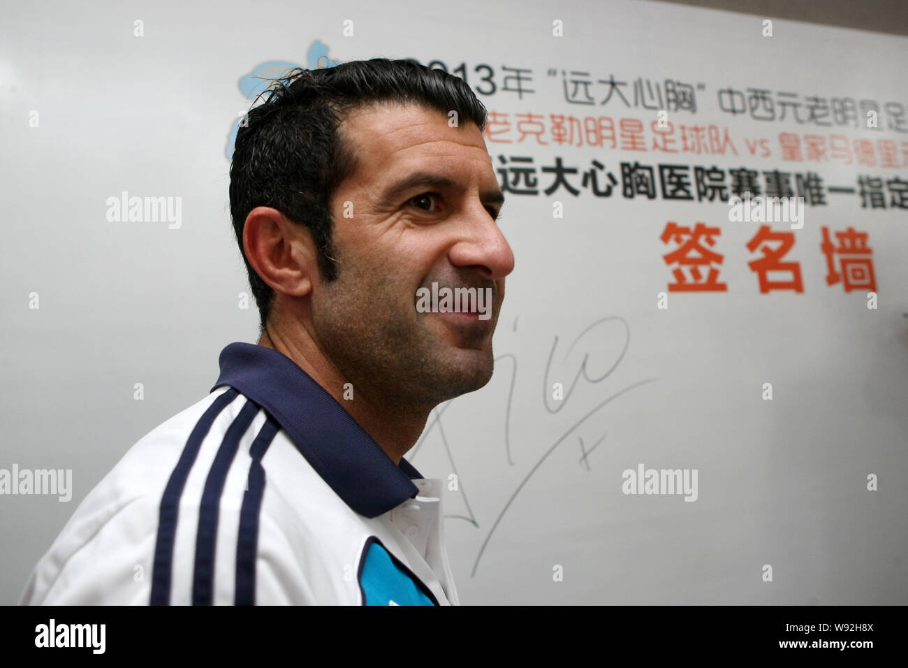 Portuguese football star Luis Figo of Real Madrid Leyendas poses with ...