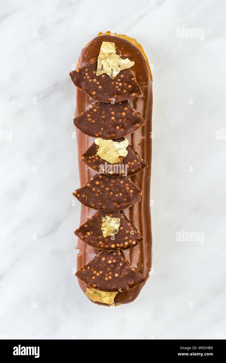Artisan French Eclair Decorated on White Marble, Top Down View Stock ...
